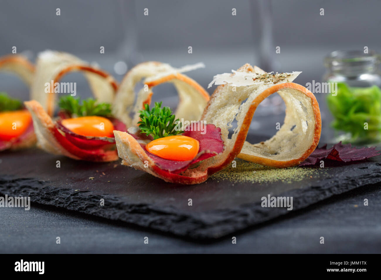 Tapas on Crusty Bread - Selection of Spanish tapas served with a sliced ...