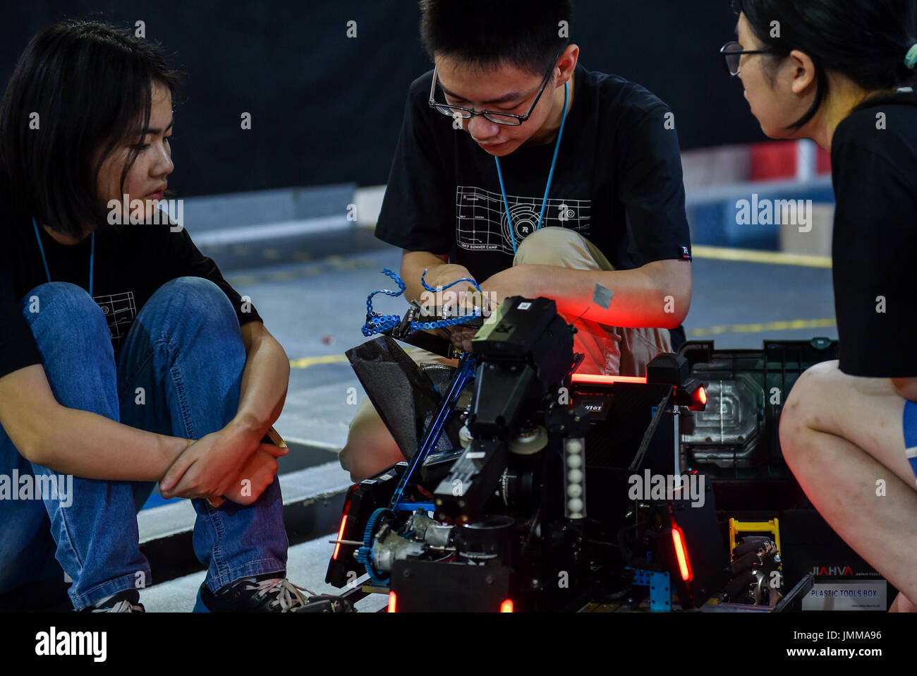Shenzhen, China's Guangdong Province. 27th July, 2017. Students adjust a robot during the robot ...