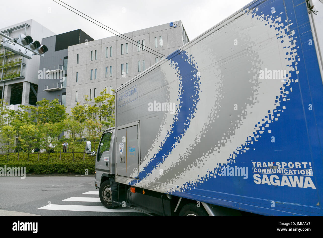 A Sagawa Express delivery truck drives past the Sagawa headquarters on ...