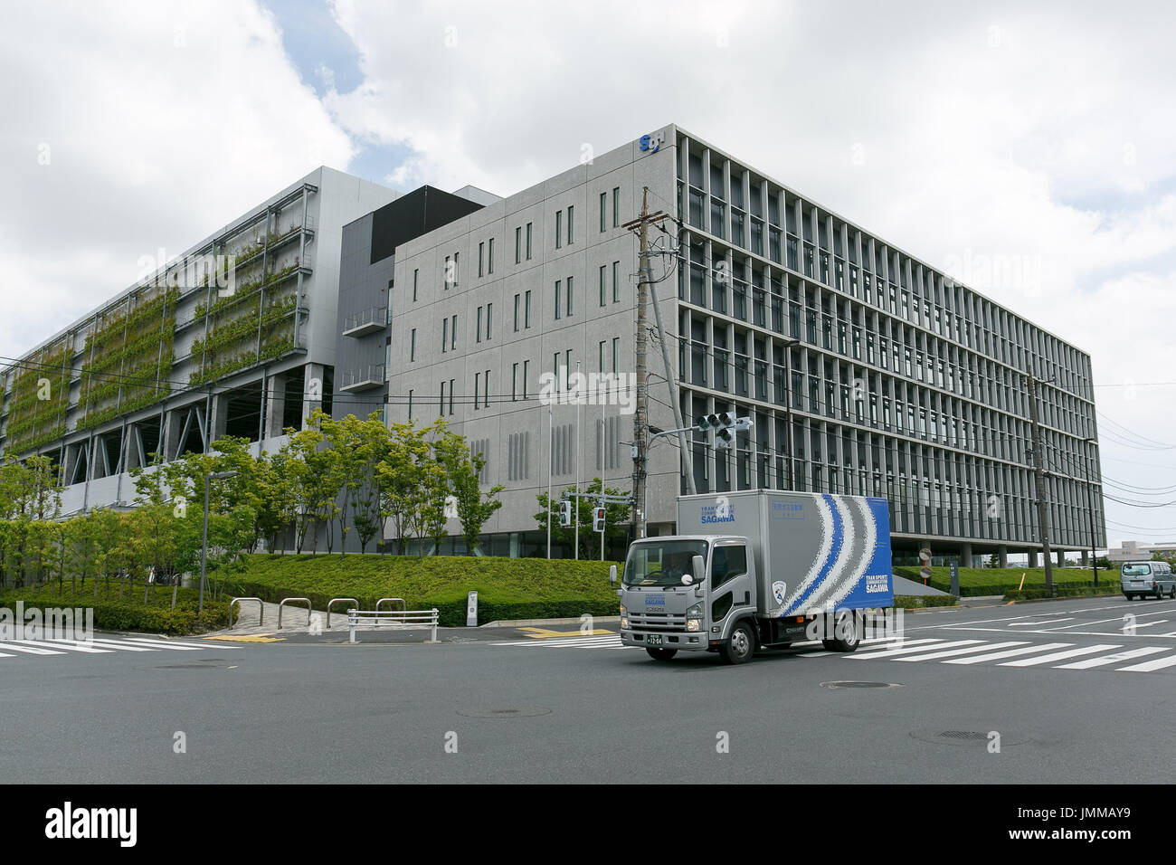A Sagawa Express delivery truck drives past the Sagawa headquarters on ...