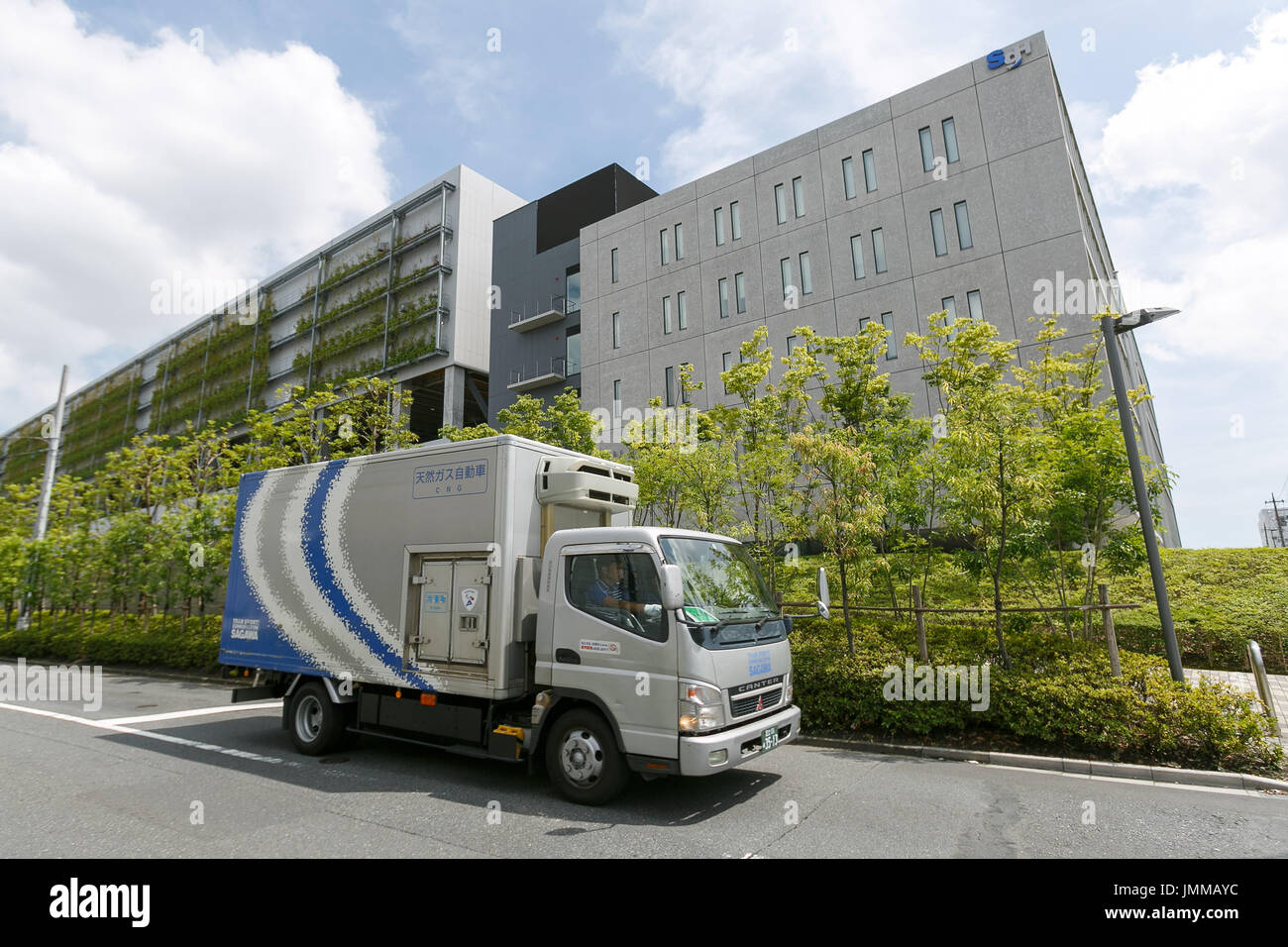 A Sagawa Express delivery truck drives past the Sagawa headquarters on ...