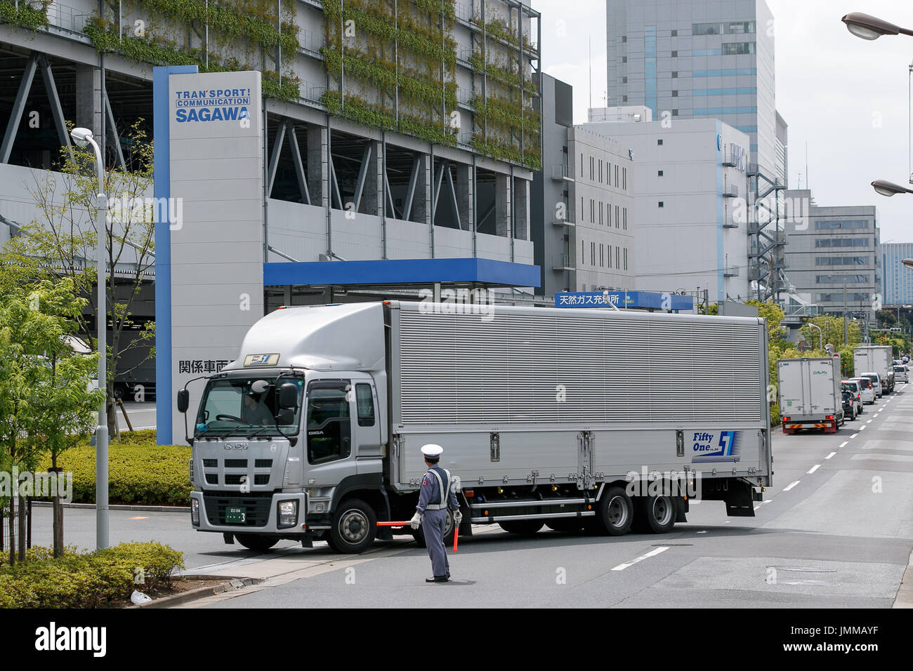 A Sagawa Express delivery truck drives past the Sagawa headquarters on ...
