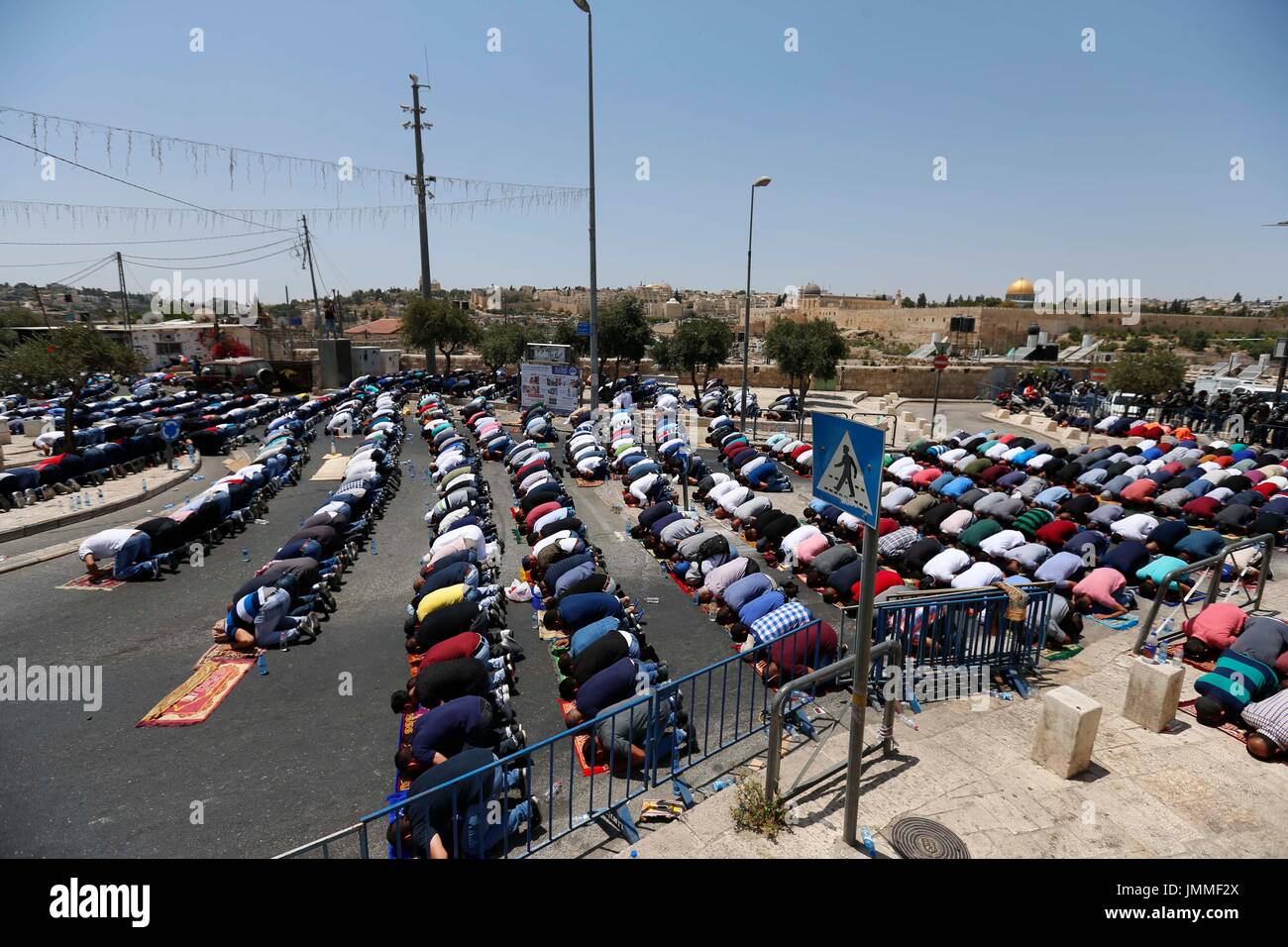 Muslim worshippers pray outside hi-res stock photography and images - Alamy