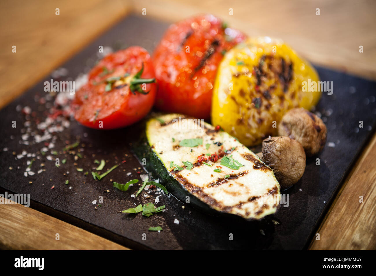Grilled vegetables on a stone board Stock Photo - Alamy