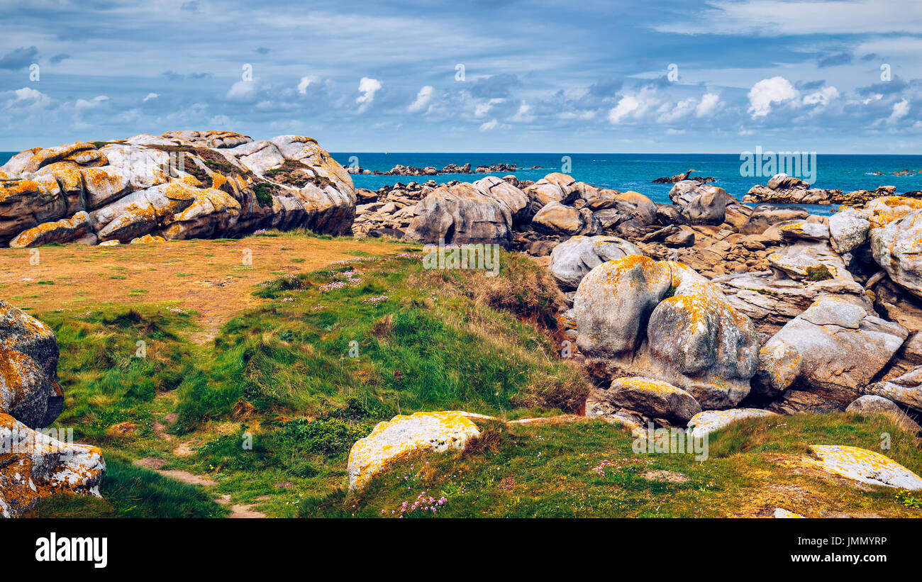 The pink granite rocks with strange shapes, coast in Brittany. The mass ...