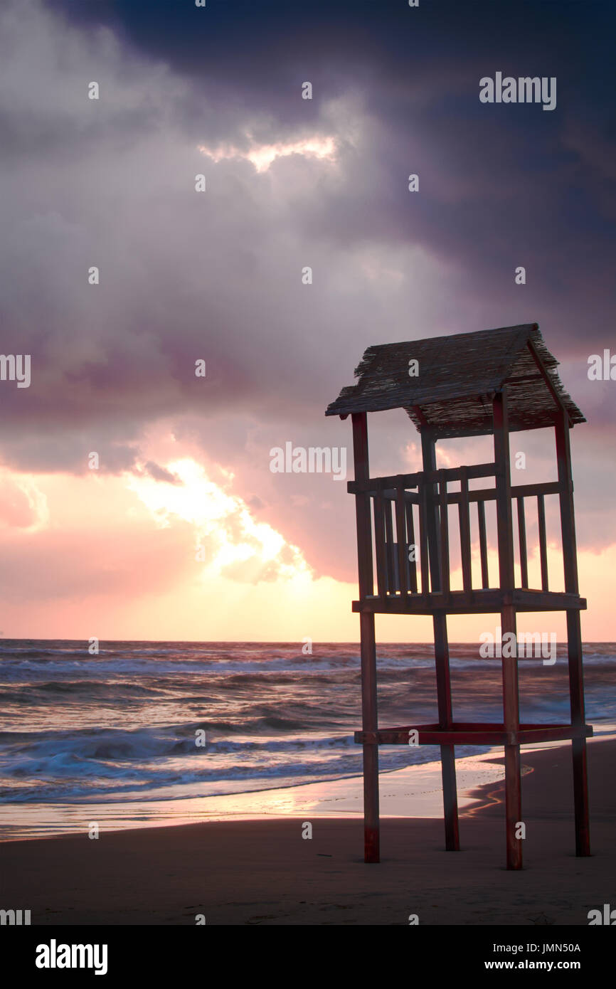 Landscape of beach with rough sea and the wooden lookout tower at ...