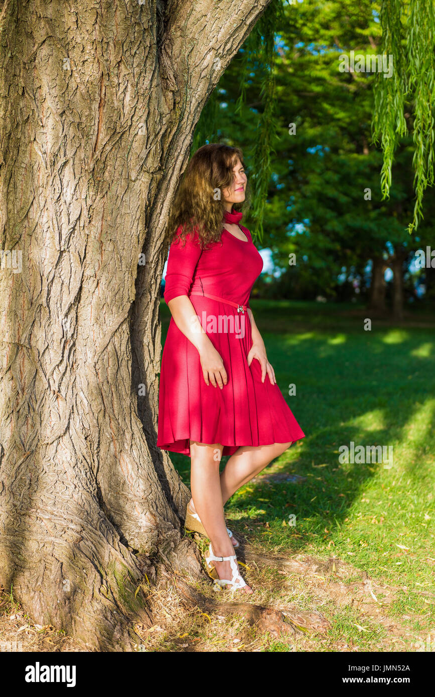 Woman the under tree in green park hi-res stock photography and images ...