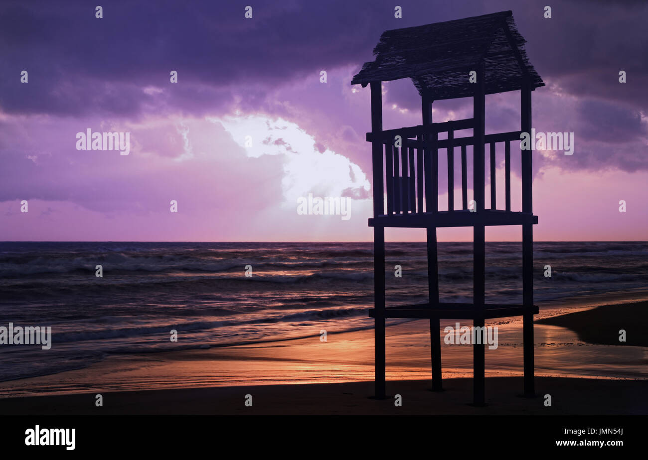 Landscape of beach with rough sea and the wooden lookout tower at ...