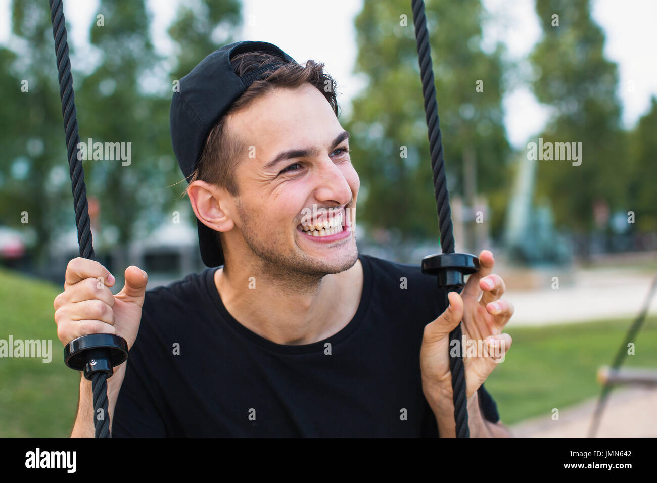 Charismatic young man smiling hi-res stock photography and images - Alamy