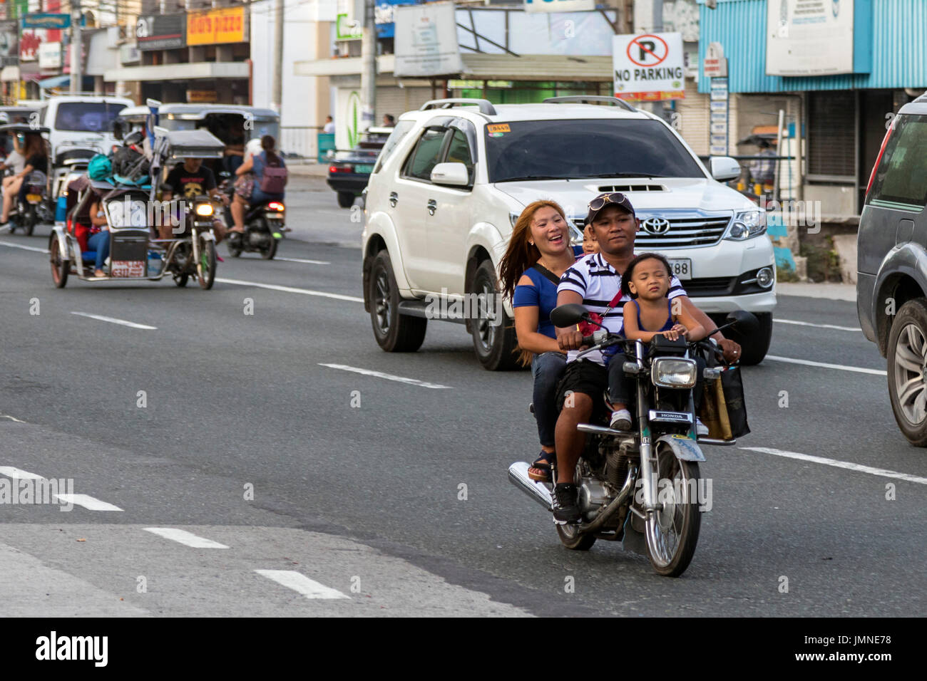 Motorbike in traffic, Angeles City, Pampanga, Philippines Stock Photo ...