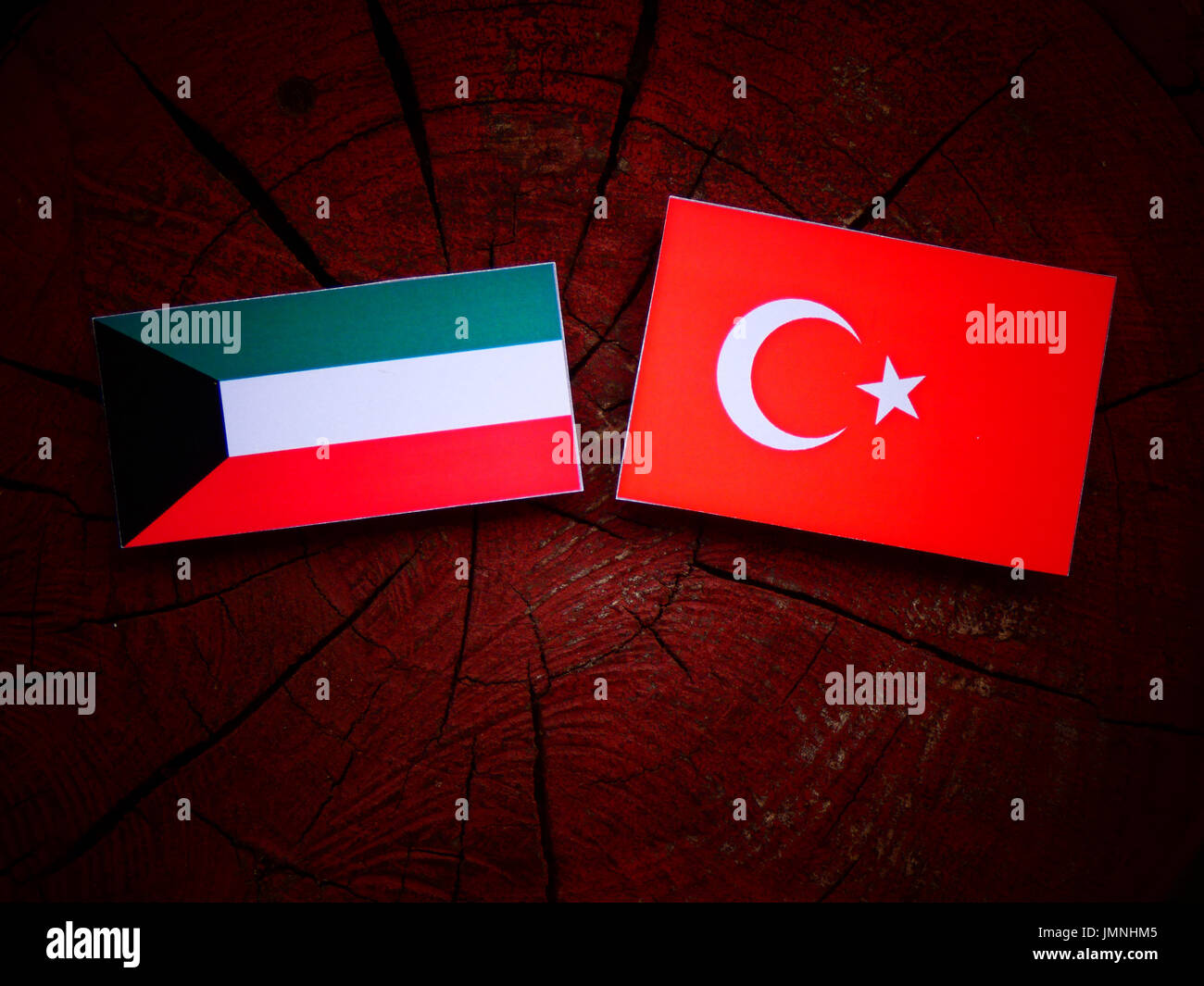 Kuwaiti flag with Turkish flag on a tree stump isolated Stock Photo - Alamy