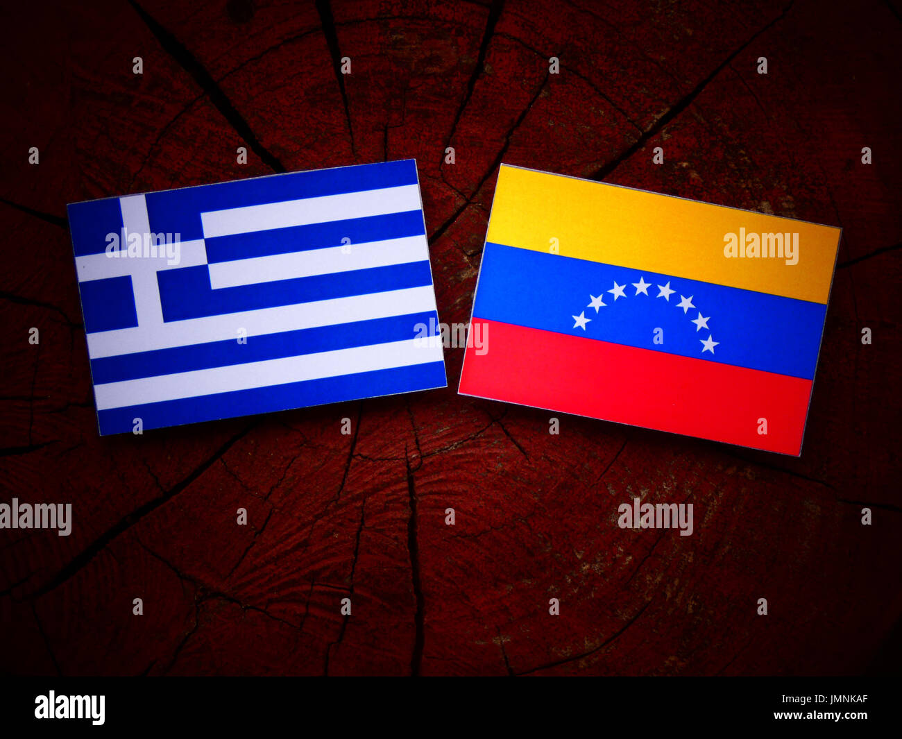 Greek flag with Venezuelan flag on a tree stump isolated Stock Photo ...