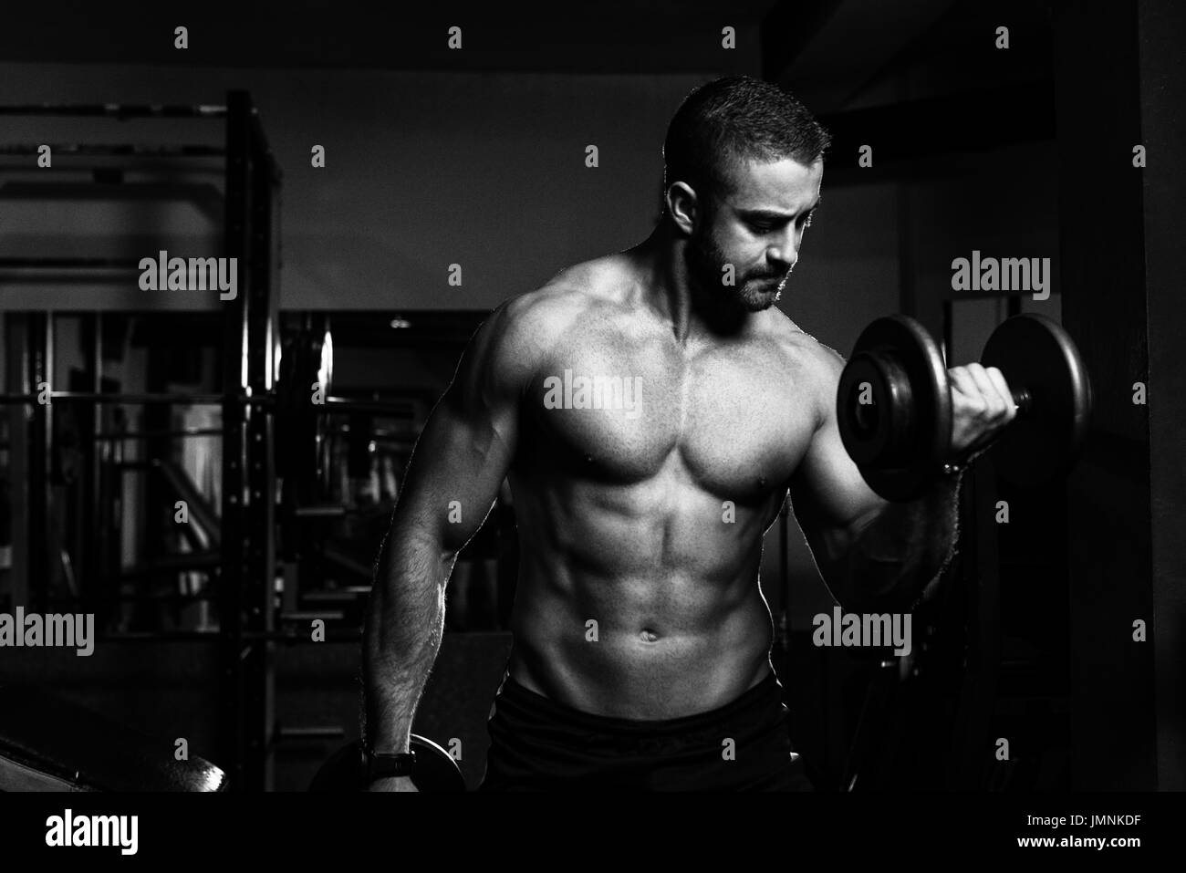 Man Working Out Biceps In A Gym - Dumbbell Concentration Curls Stock ...