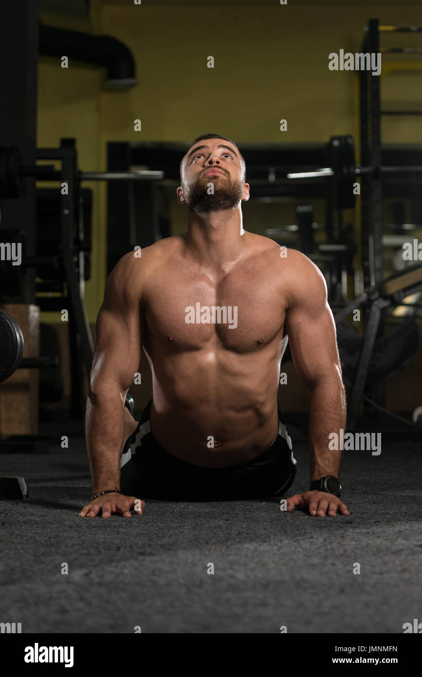 Stretches young man gym hi-res stock photography and images - Alamy
