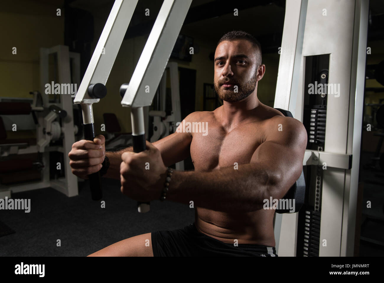 Handsome Muscular Fitness Bodybuilder Doing Heavy Weight Exercise For ...