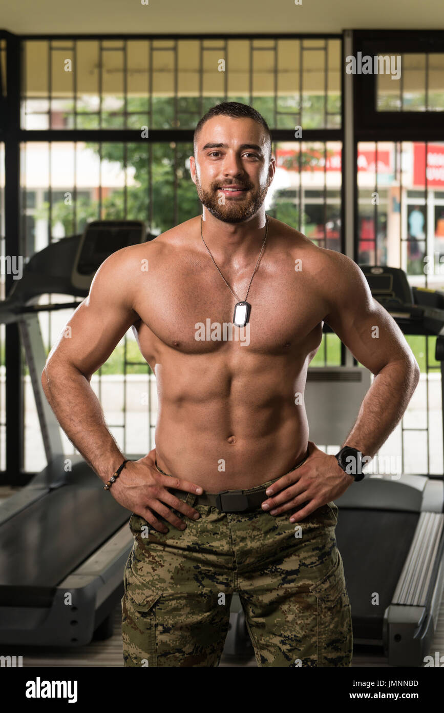 Portrait Of A Young Physically Fit Man Showing His Well Trained Body In ...
