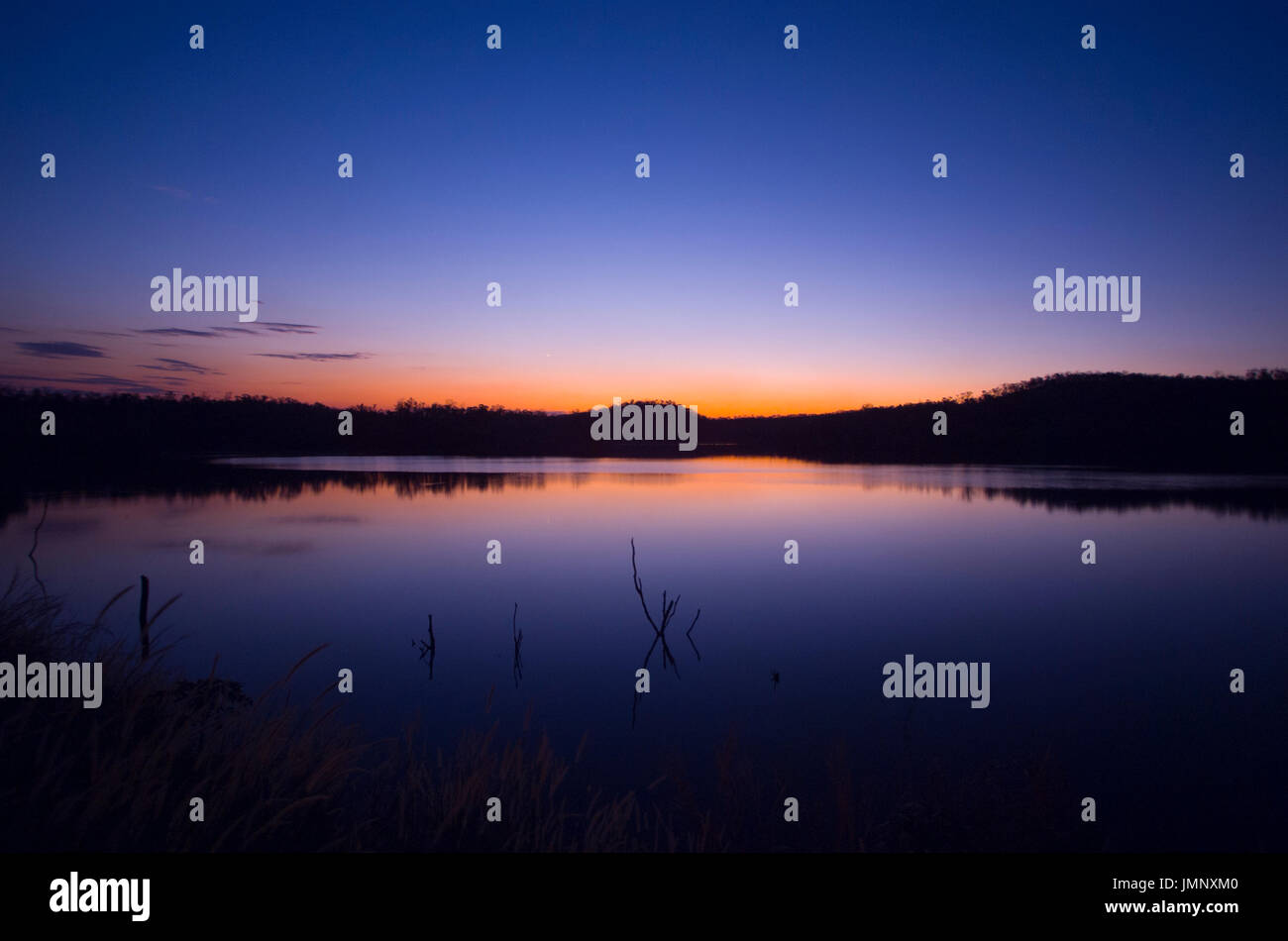 lake bennett in dusk light with super blue and magenta hues, shimmering ...