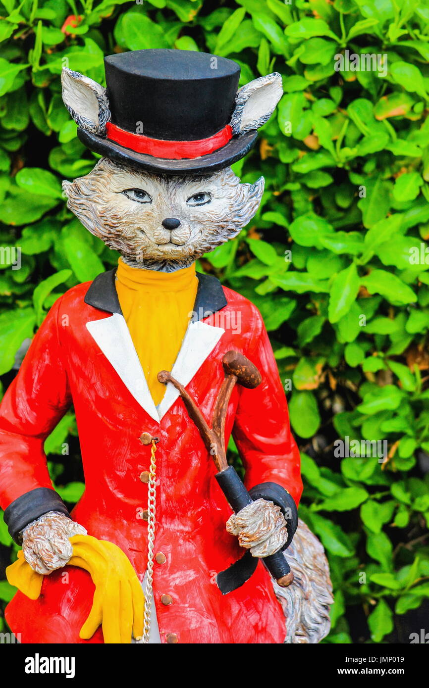 Close up image of a gentleman fox garden ornament Stock Photo - Alamy