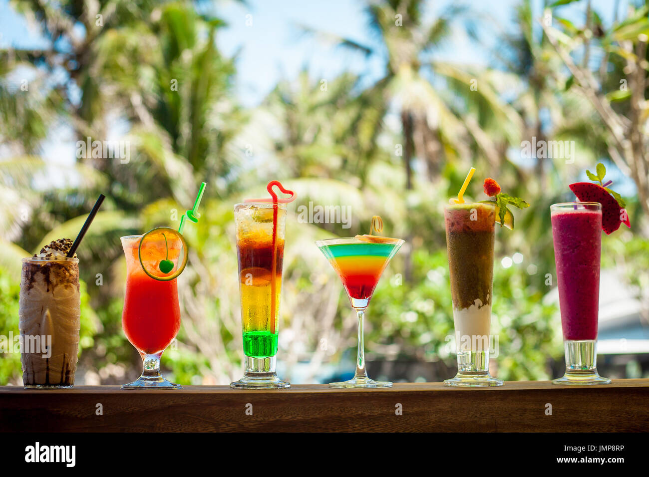 Set of iced cocktails: layered, orange, blue and red, chocolate ...