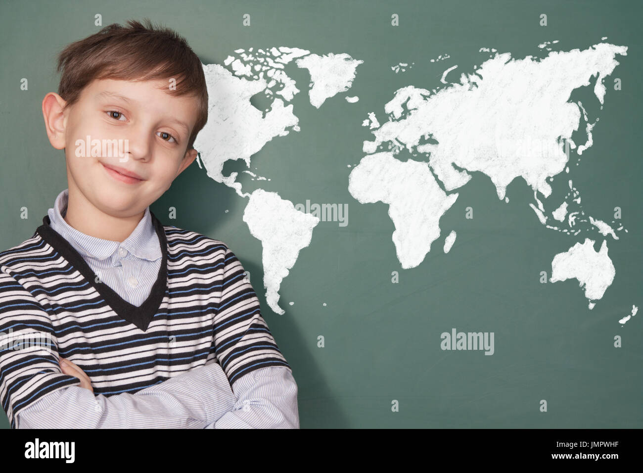 Smiling boy before Chalk drawing of World map Stock Photo - Alamy