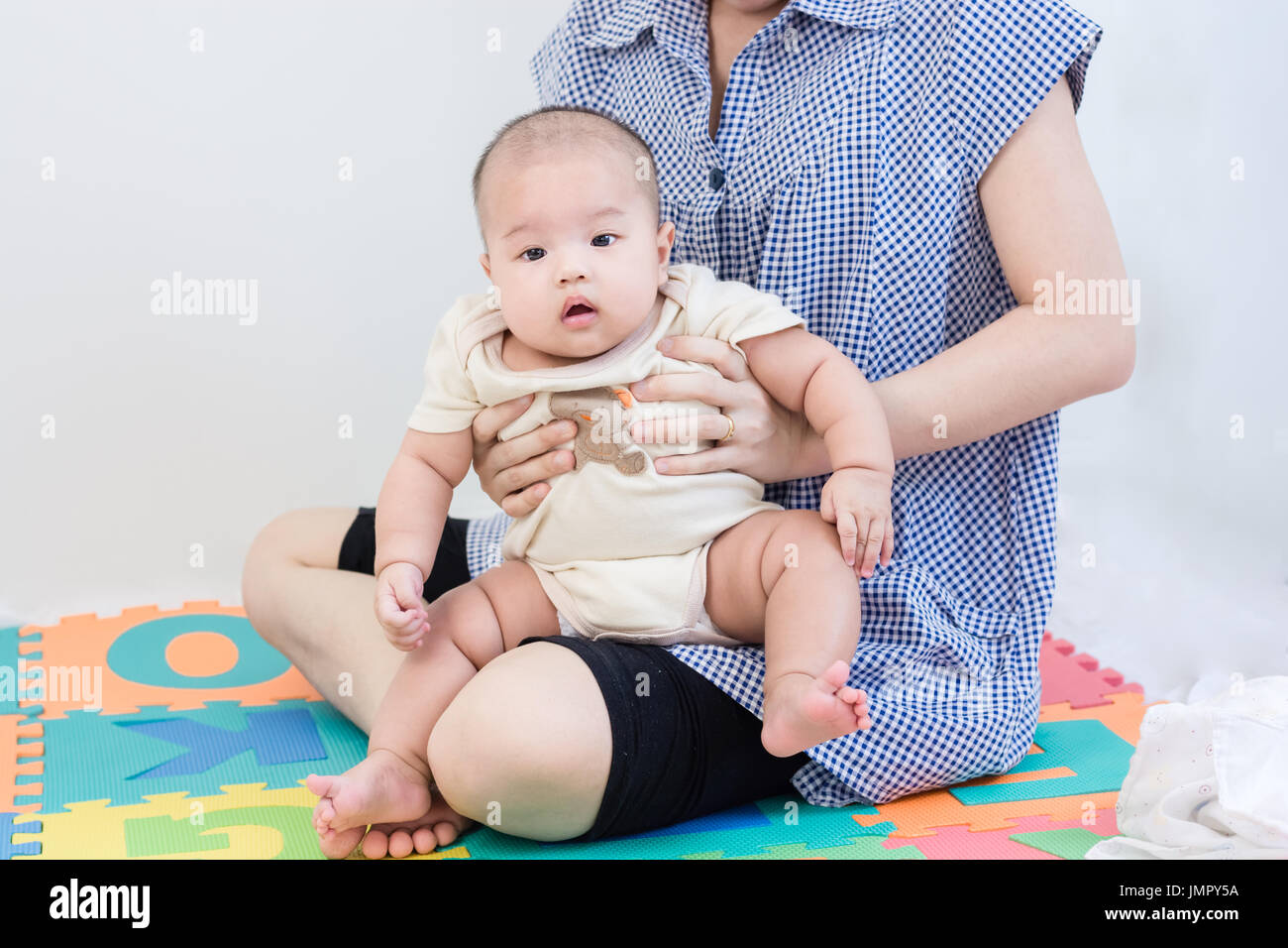 Mom holding son on lap hi-res stock photography and images - Alamy