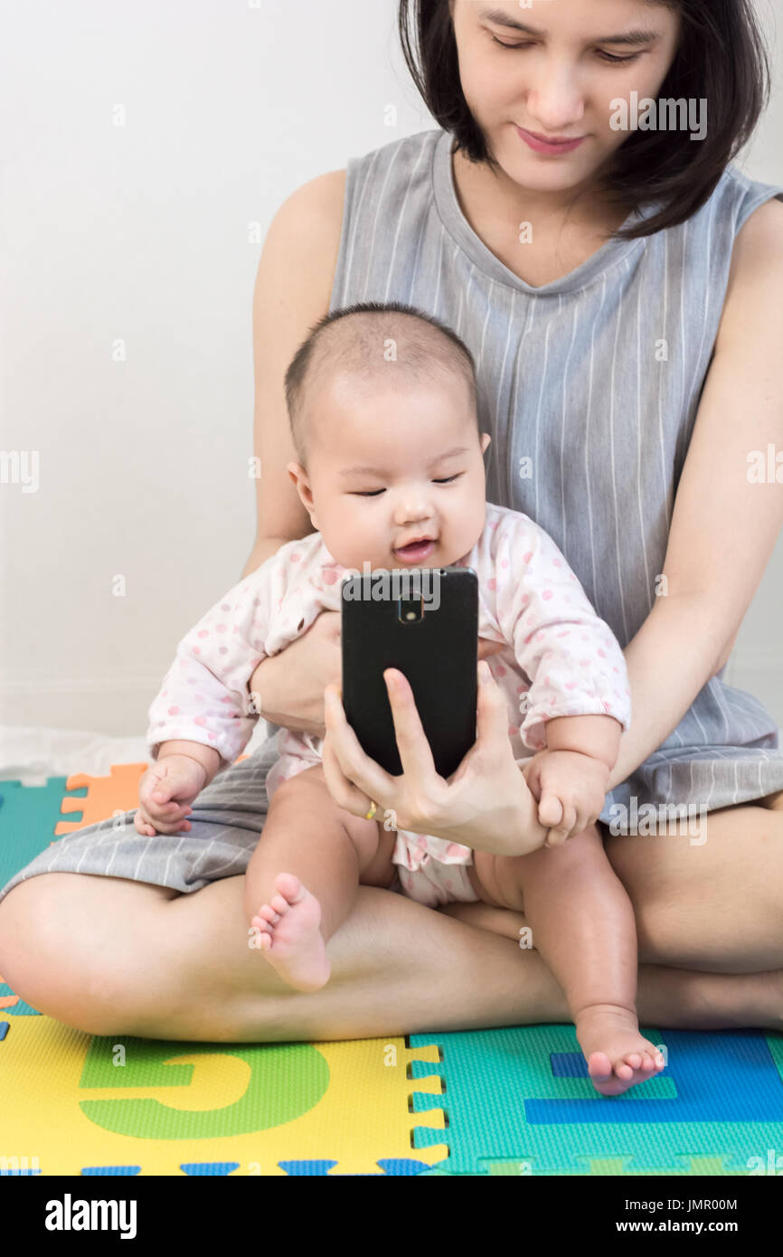 Sitting girl with boy on her lap hi-res stock photography and images ...