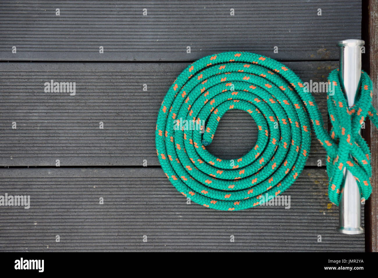 Mooring rope in spiral on a pier Stock Photo - Alamy