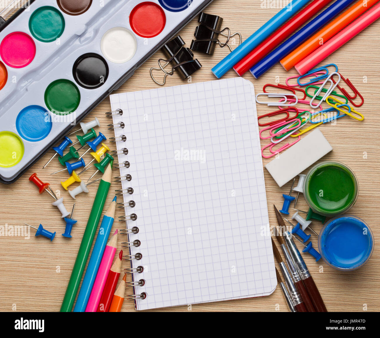 Notepad with stationary objects on wooden background Stock Photo - Alamy