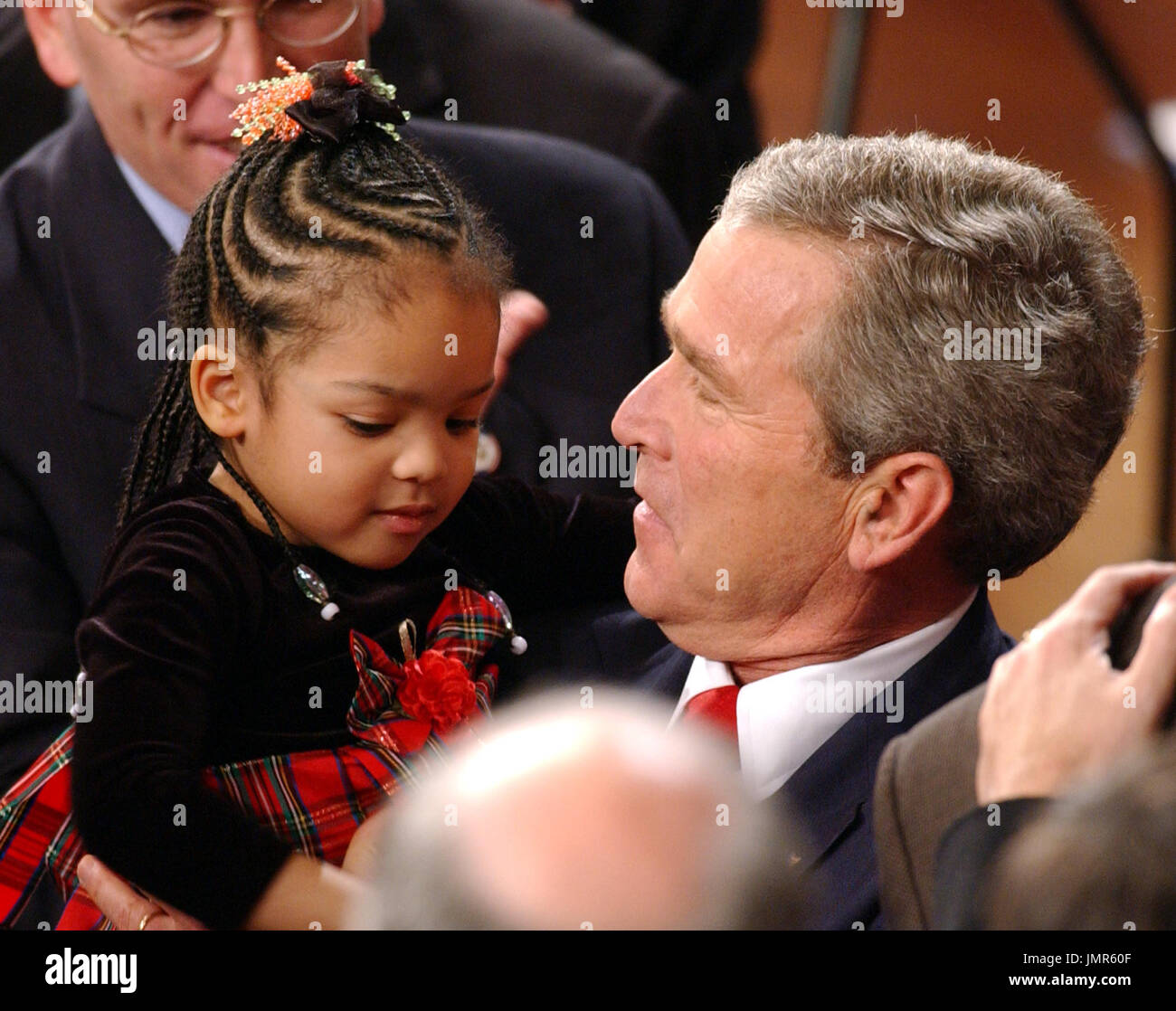 United States President George W. Bush gets a hug from Jessica Jackson ...