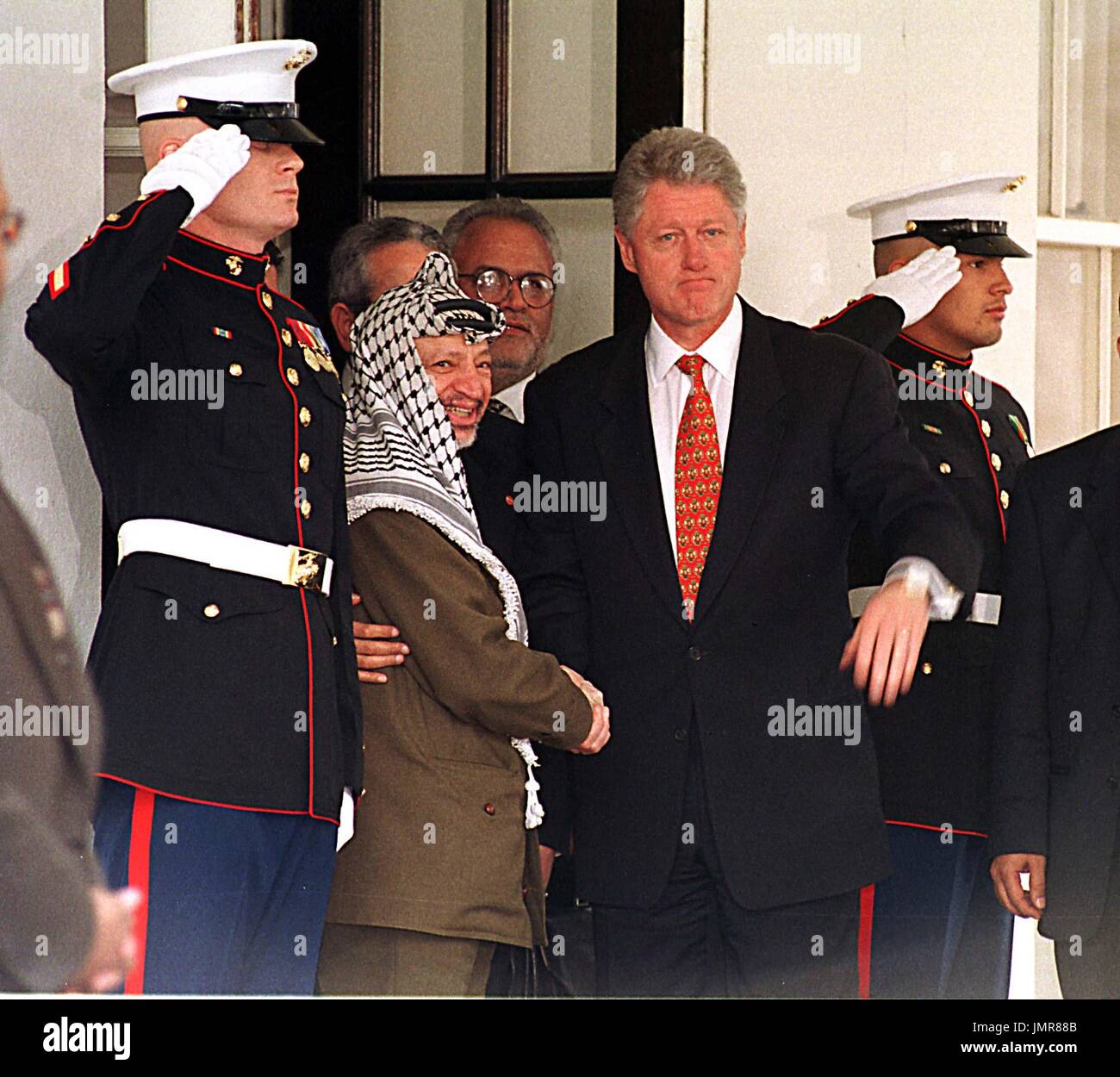 United States President Bill Clinton shakes hands with Palestinian ...