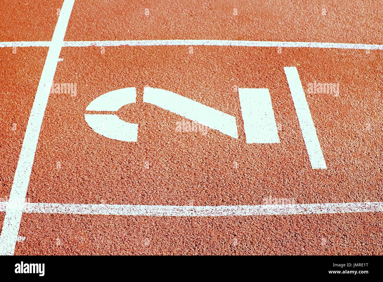 Number two. Big white track number on red rubber racetrack. Gentle ...