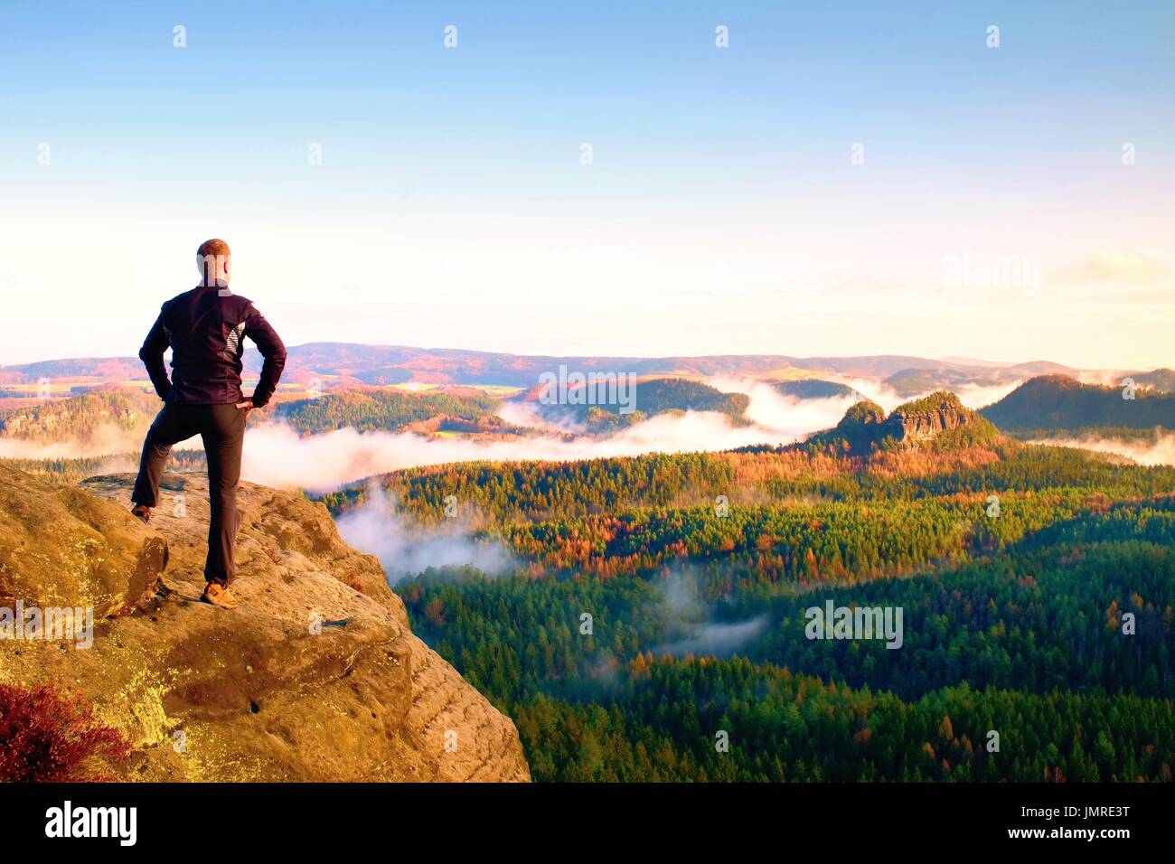 Hiker stand on cliff of sandstone empires park and watching over the ...