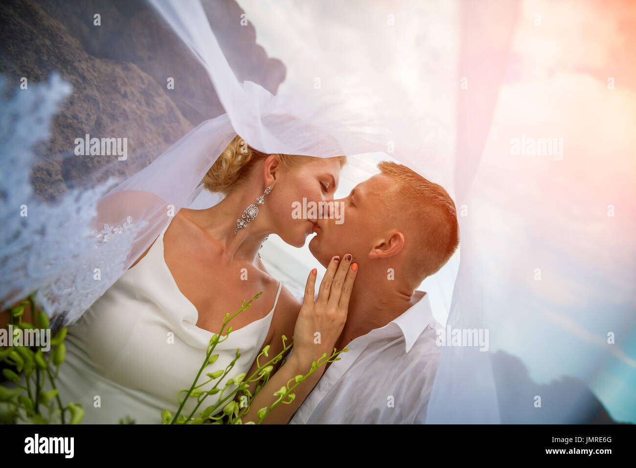 Newly married couple kissing in hi-res stock photography and images - Alamy