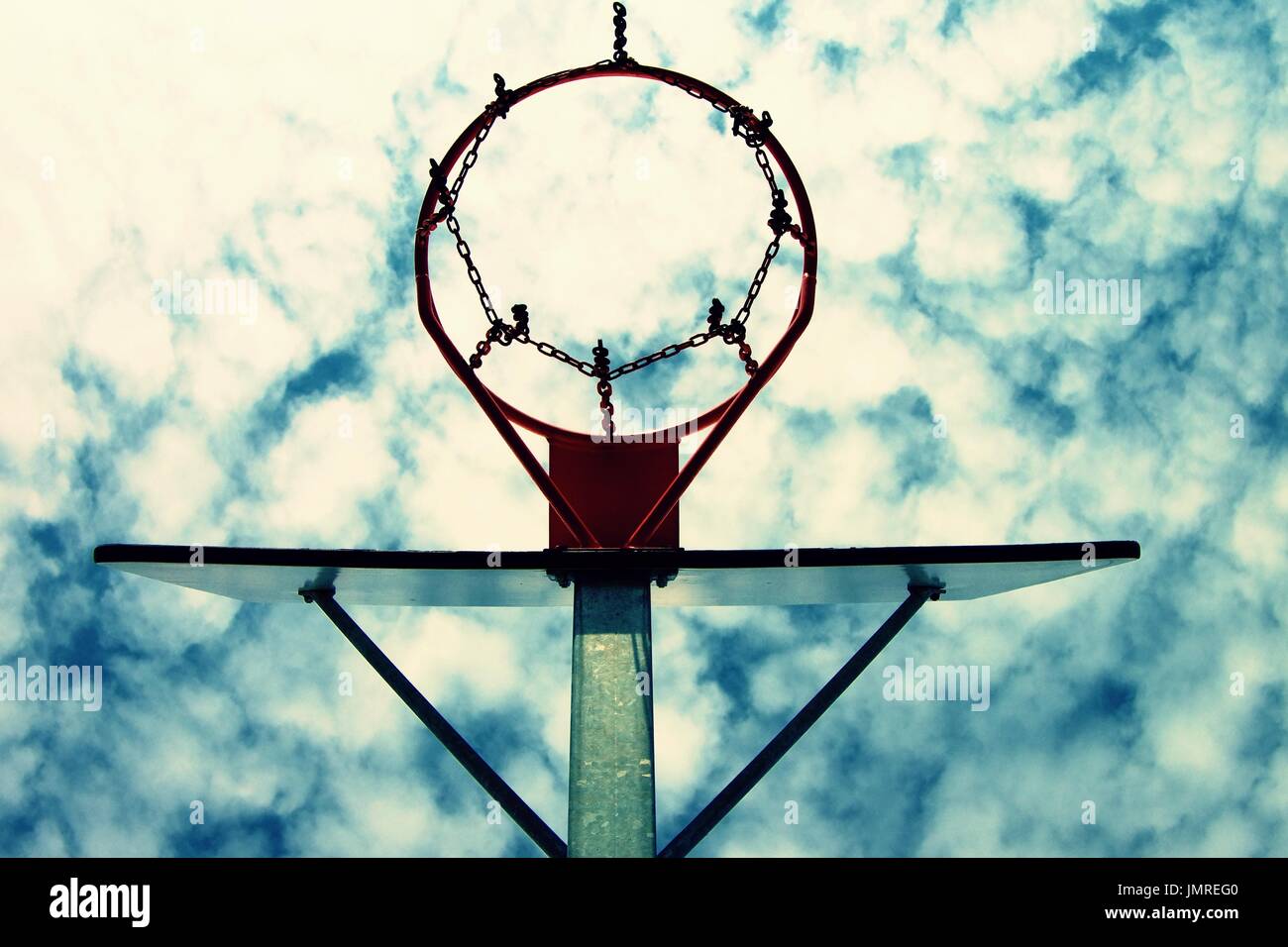 Old neglect basketball backboard with rusty hoop above street court ...