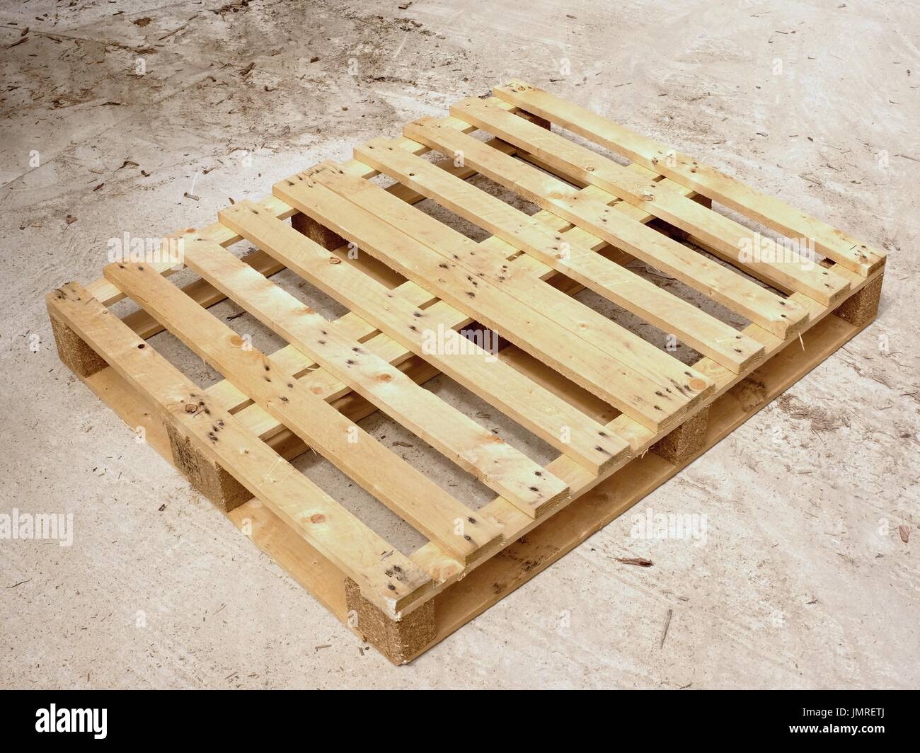 Wooden pallet on worn out concrete ground. Empty pallet ready for ...