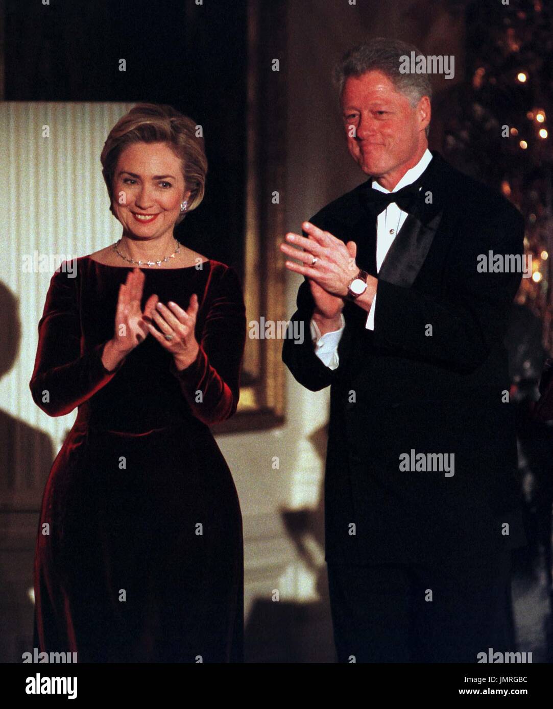 Washington, DC - December 6, 1998 -- President and Mrs. Clinton applaud ...