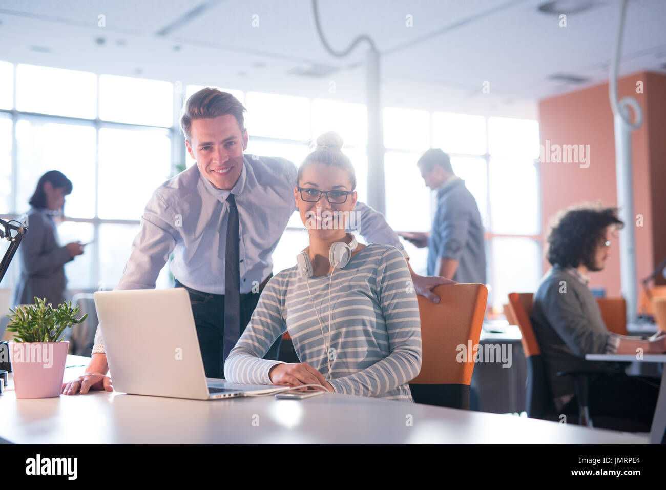 two business people using laptop preparing for next meeting and ...
