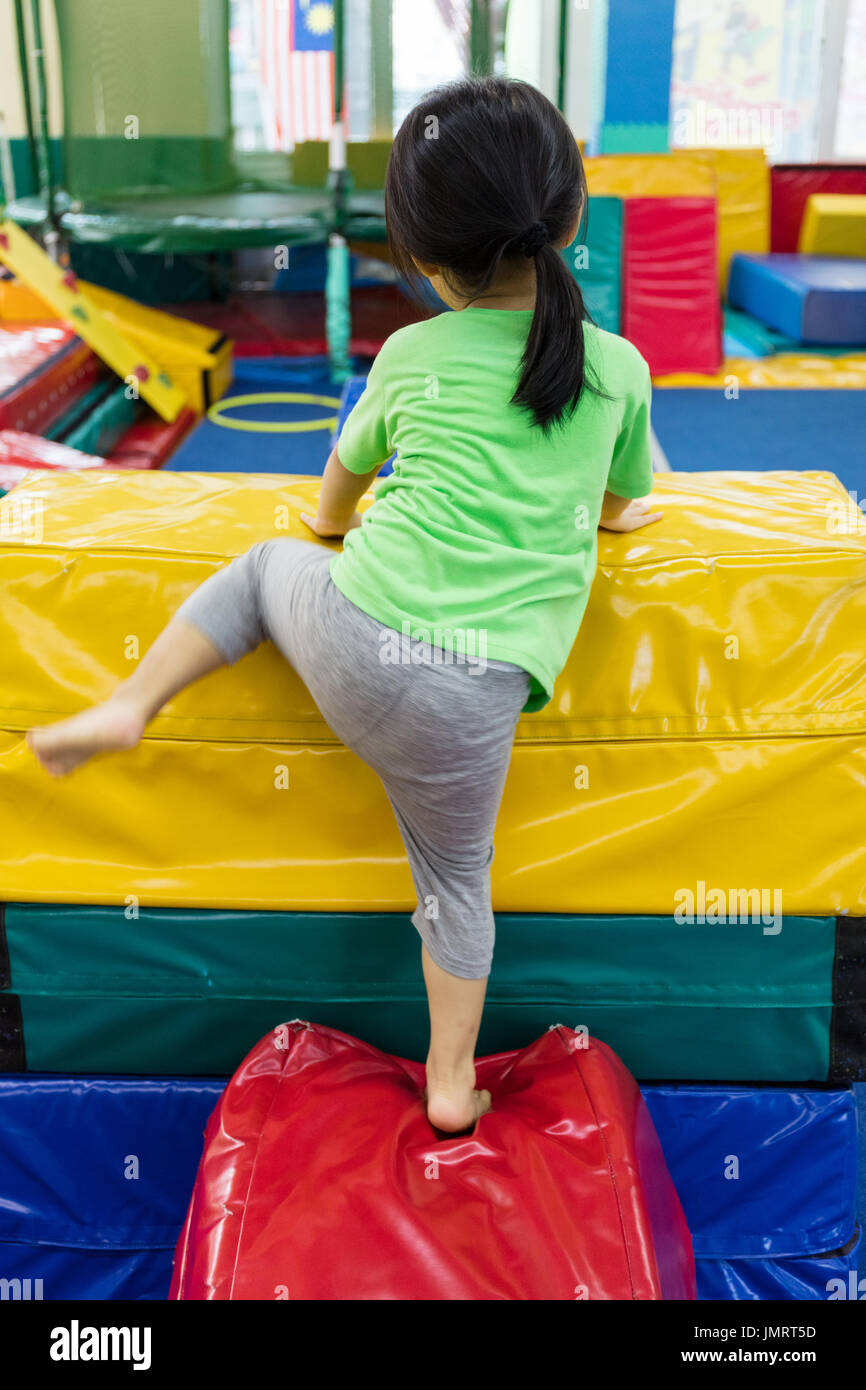Asian Chinese little girl playing at indoor playground Stock Photo - Alamy