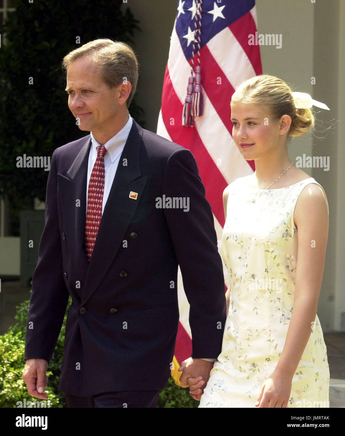 Washington, DC - April 30, 2003 -- Ed Smart holds the hand of his ...