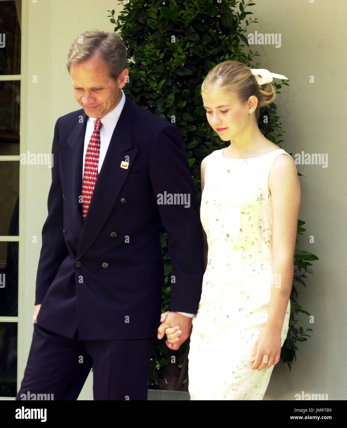Washington, DC - April 30, 2003 -- Ed Smart holds the hand of his ...