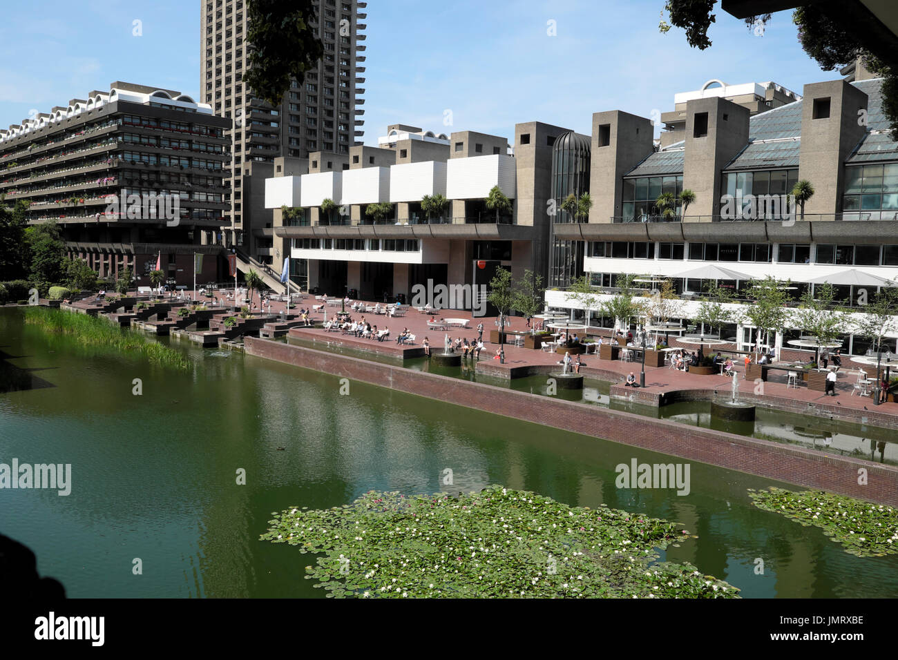 Exterior lakeside view of the Barbican Art Centre restaurant, people ...