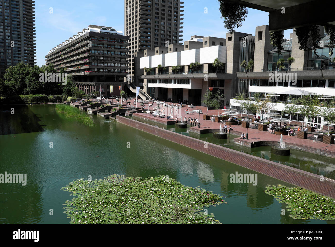 Exterior lakeside view of the Barbican Art Centre restaurant, people ...