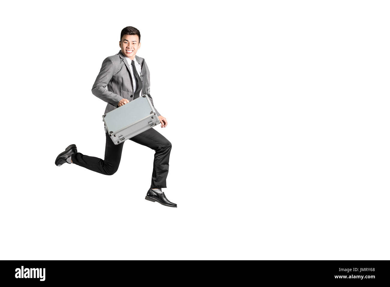 Portrait of a young business man running. Isolated on white background ...