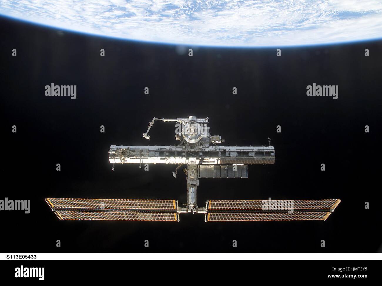 Backdropped by the blackness of space and EarthÕs horizon, this full ...