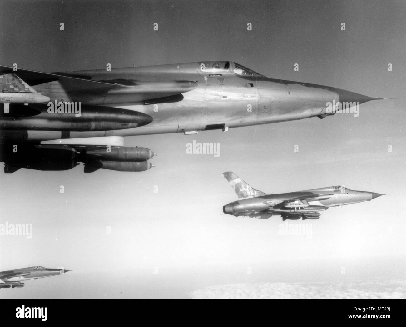 F-105 Thunderchiefs of the 355th Tactical Fighter Wing streak toward an ...