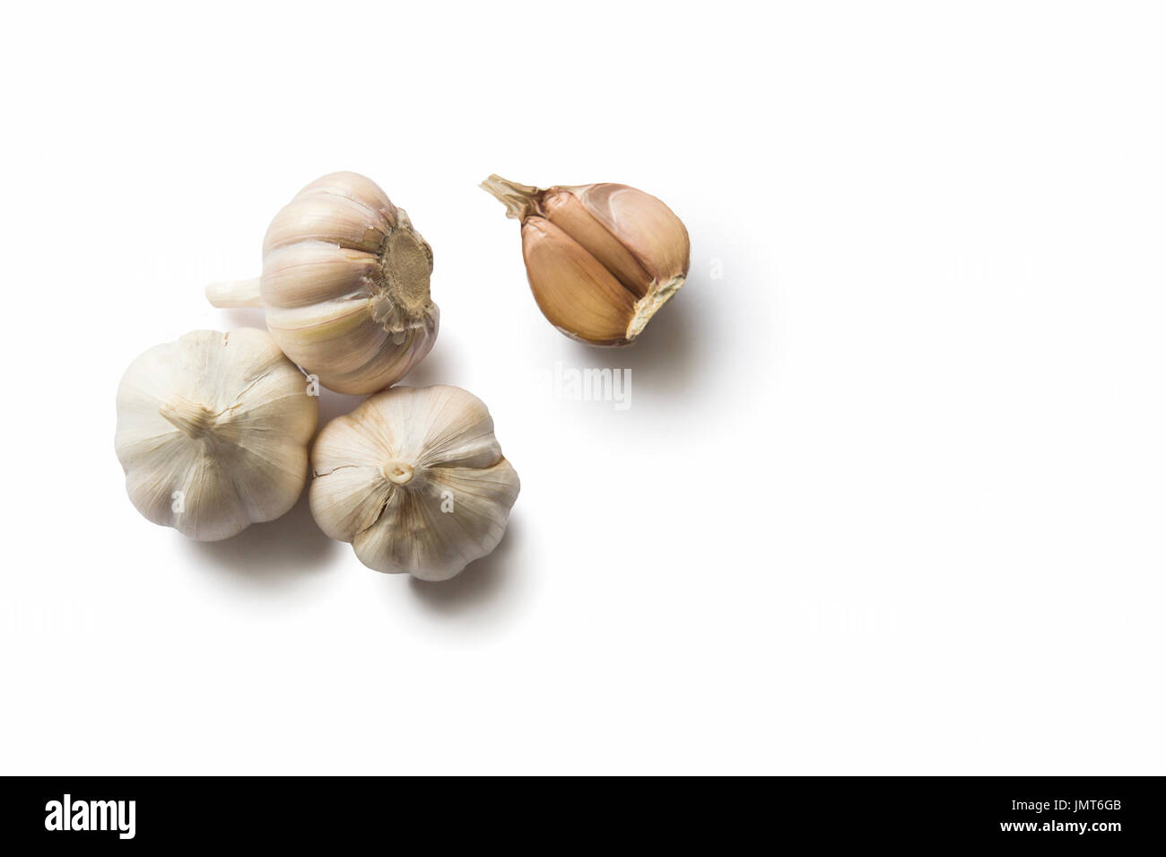 Garlic on solid white background Stock Photo - Alamy