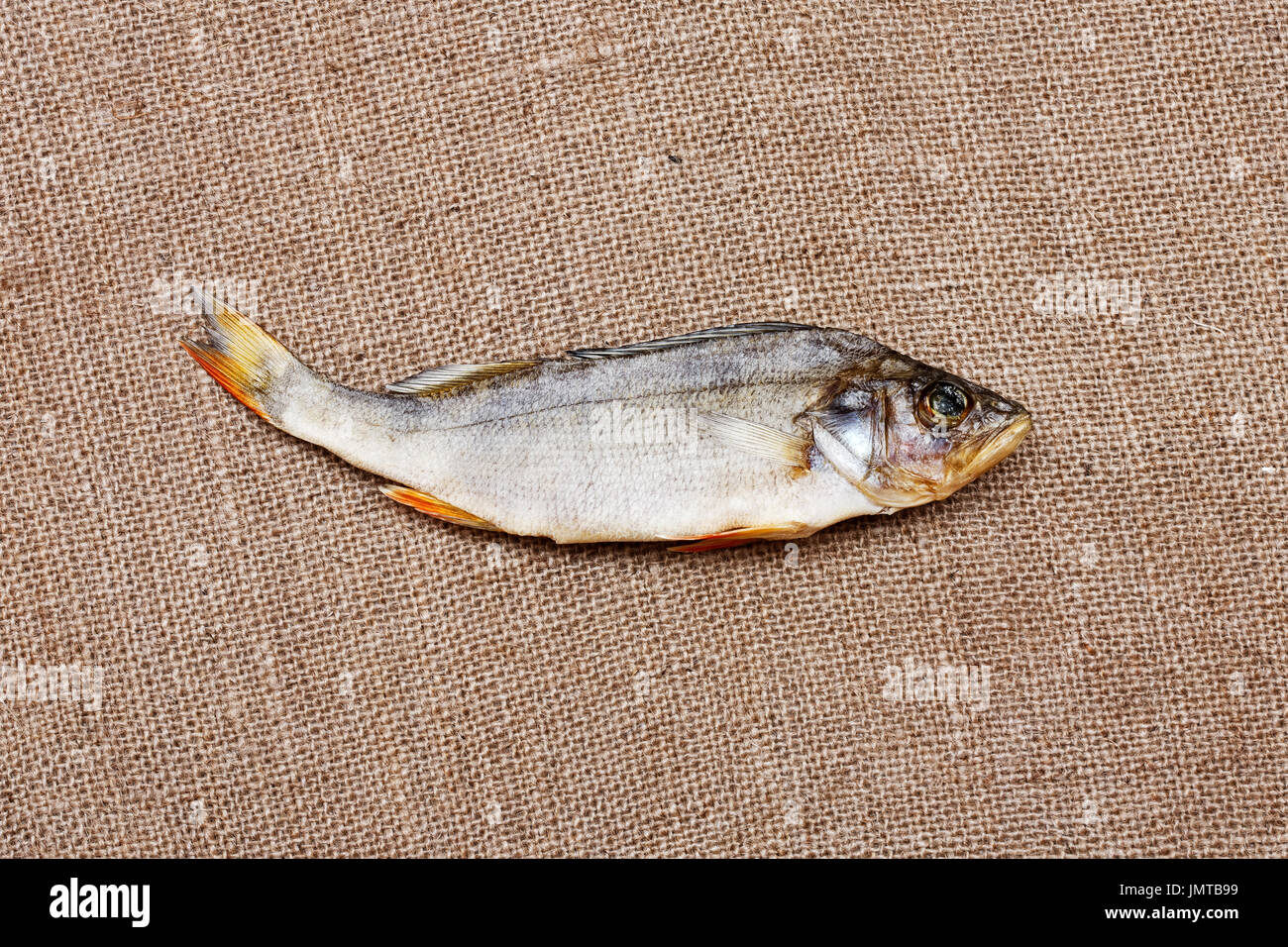 Dried fish on the burlap close-up Stock Photo - Alamy