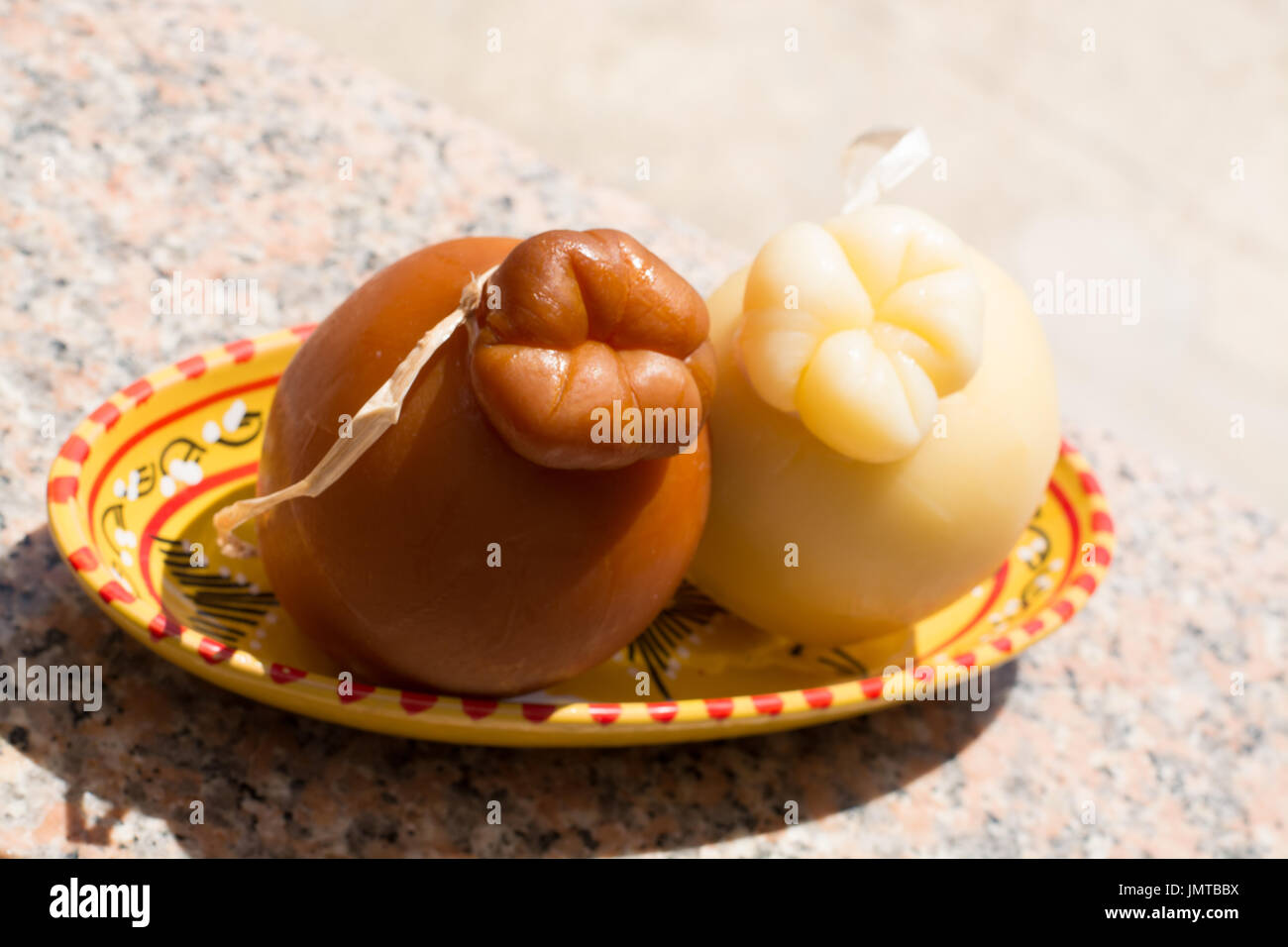Traditional Italian hard cheese Provolone of Caciocavallo, white and ...