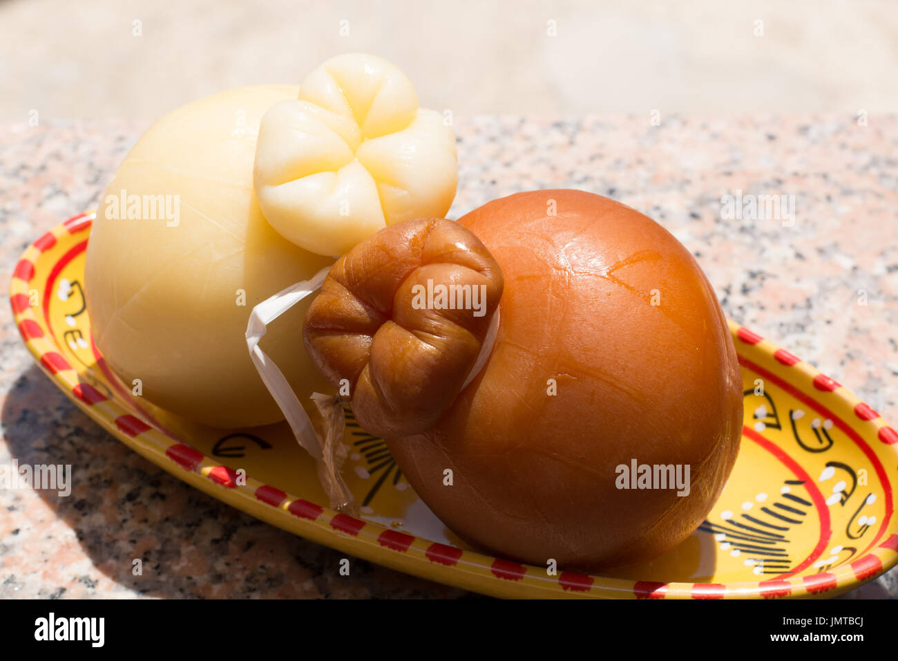 Traditional Italian hard cheese Provolone of Caciocavallo, white and ...