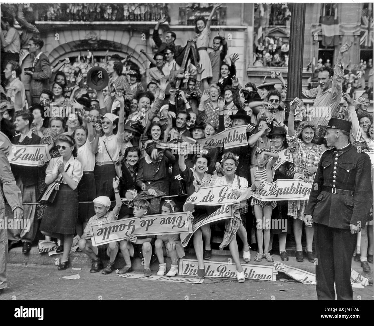 Paris, France - August 26, 1944 -- French civilians line the streets ...